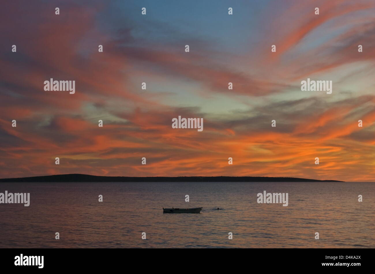 (dpa file) - A fishing boat lies in the sea during sunset at the ...