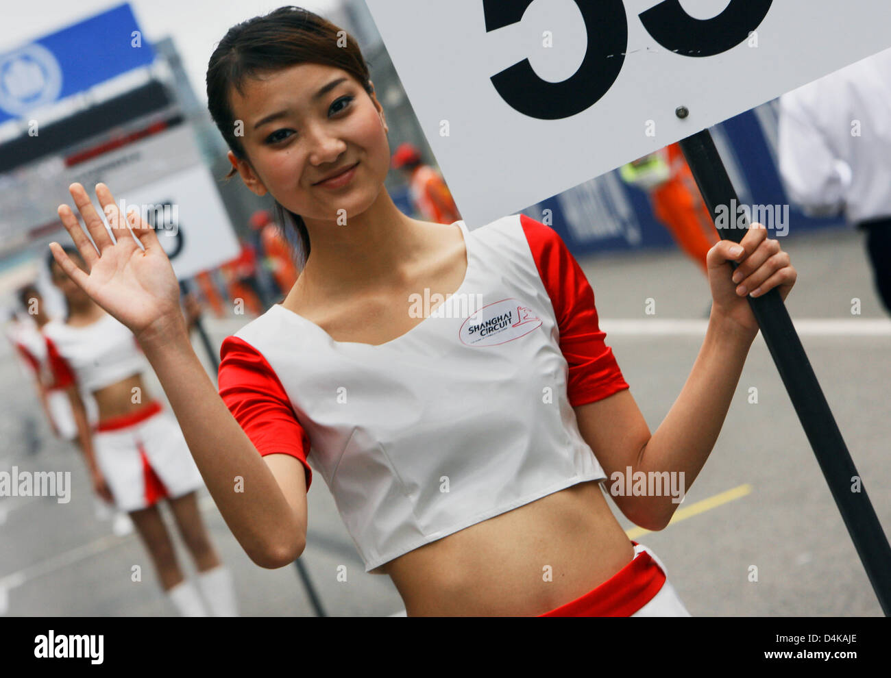 A grid girls poses before the start of the Formula 1 Chinese Grand Prix ...