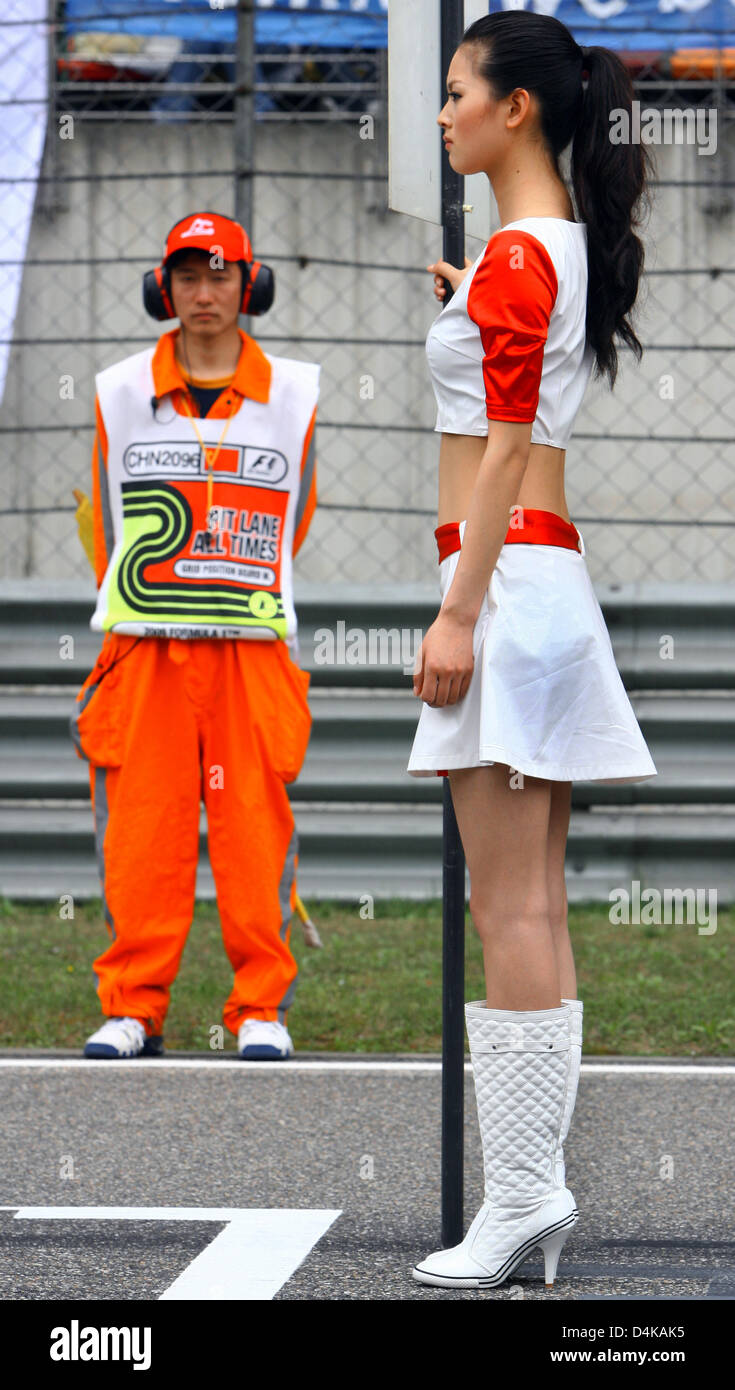 A grid girl poses before the start of the Formula 1 Chinese Grand Prix ...