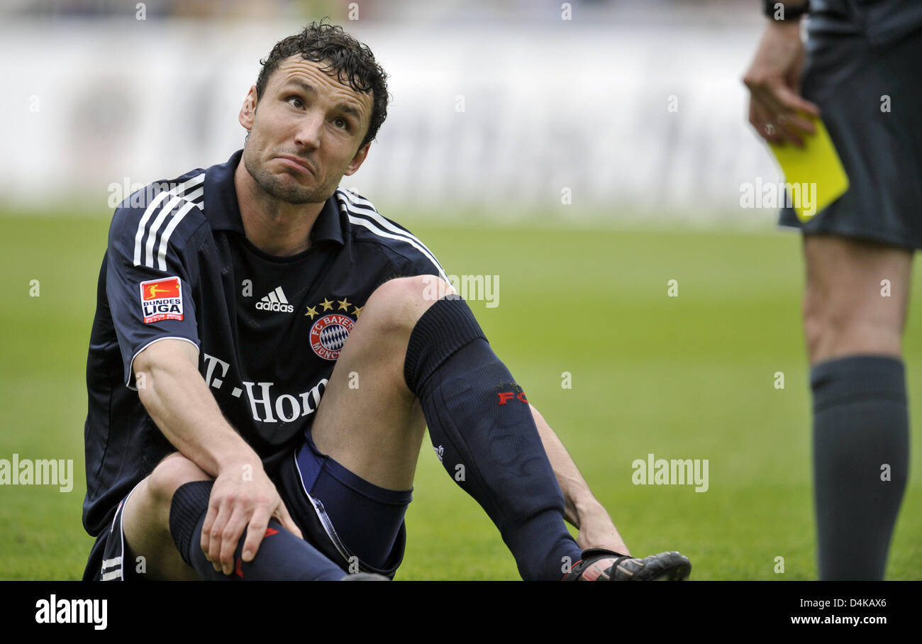 Bayern Munich?s team captain Mark van Bommel sits on the lawn during ...