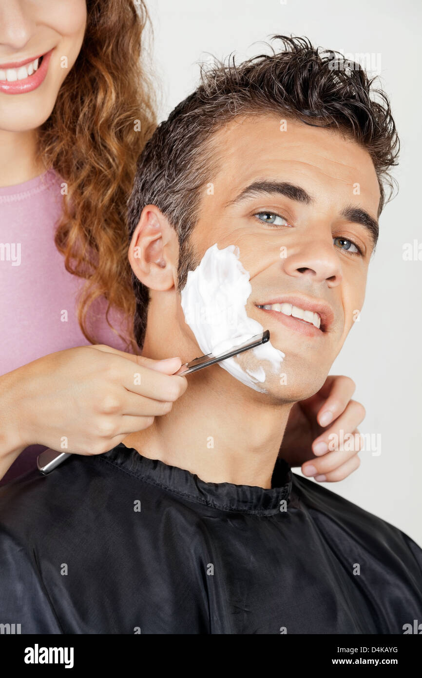 Man Getting A Shave From Barber Stock Photo - Alamy