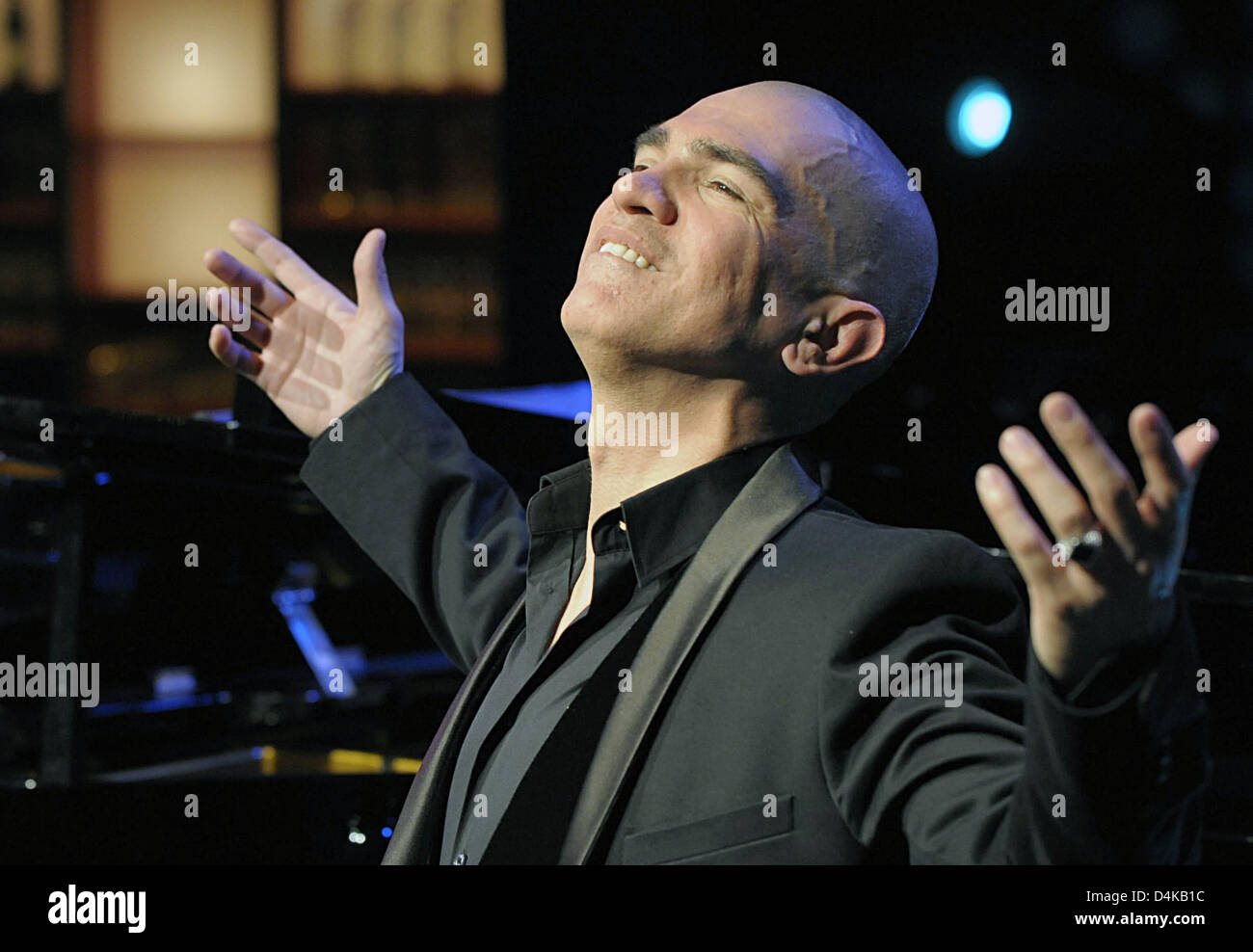Brazilian singer Edson Cordeiro stands on the stage and sings during a ...