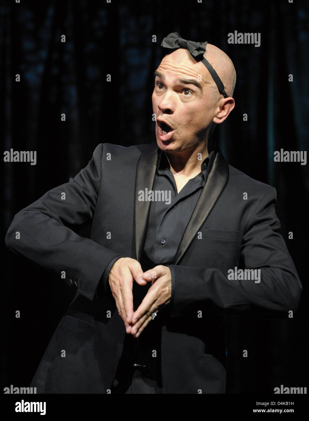 Brazilian singer Edson Cordeiro stands on the stage and sings during a ...