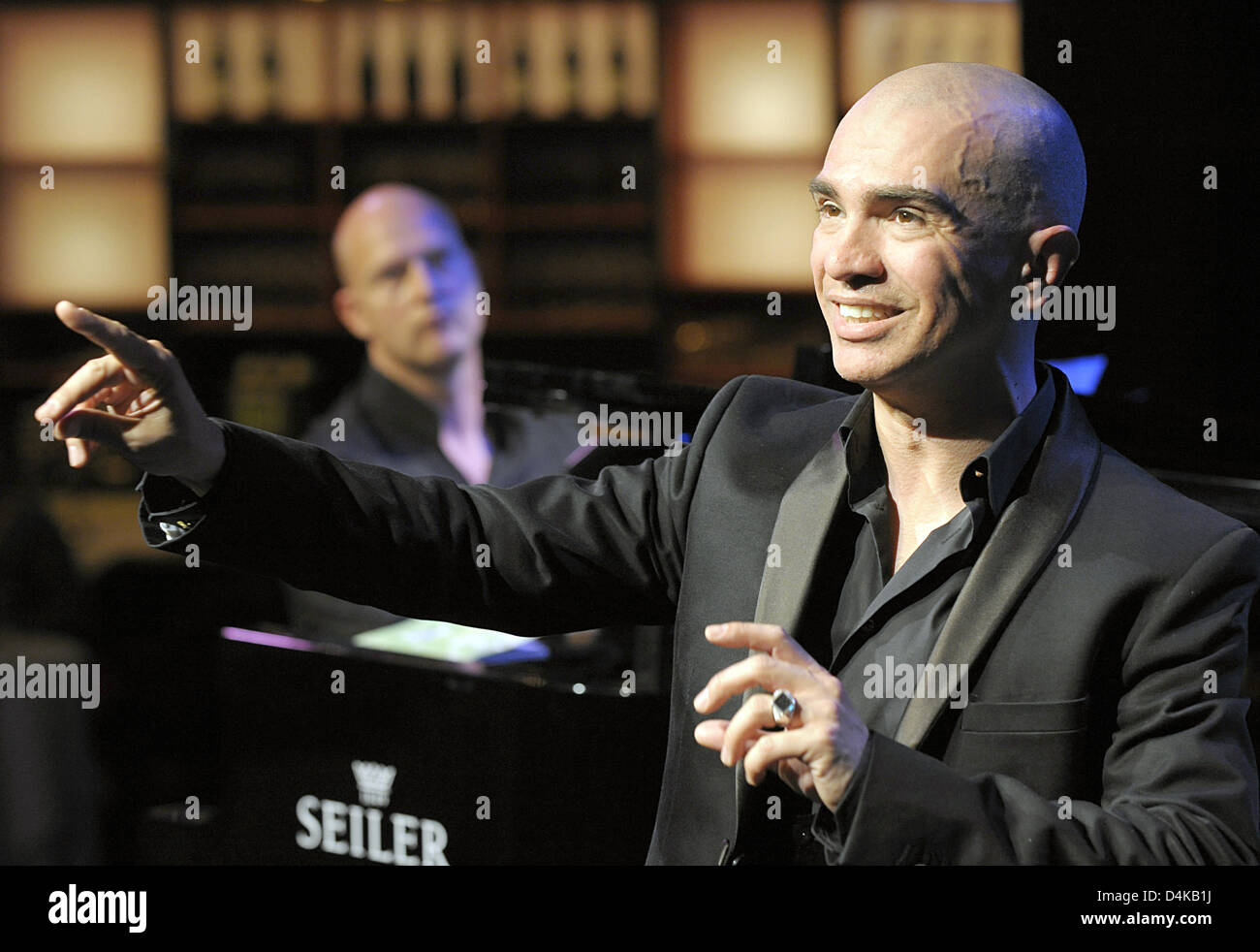 Brazilian singer Edson Cordeiro stands on the stage and sings during a ...