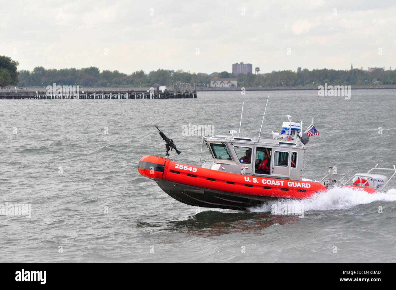 The U.S. Coast Guard Station New York provides an escort for ferries ...