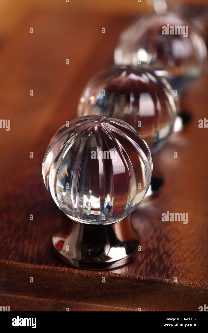 line of glass door knobs Stock Photo - Alamy