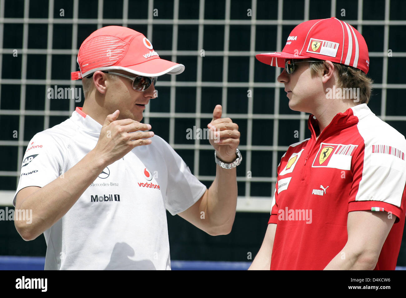 Finnish Formula One driver Heikki Kovalainen (L) of McLaren Mercedes ...