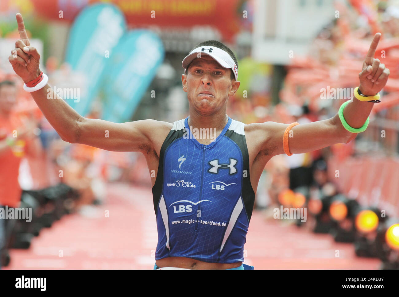 Australia?s Chris McCormack crosses the finish line third at the ...