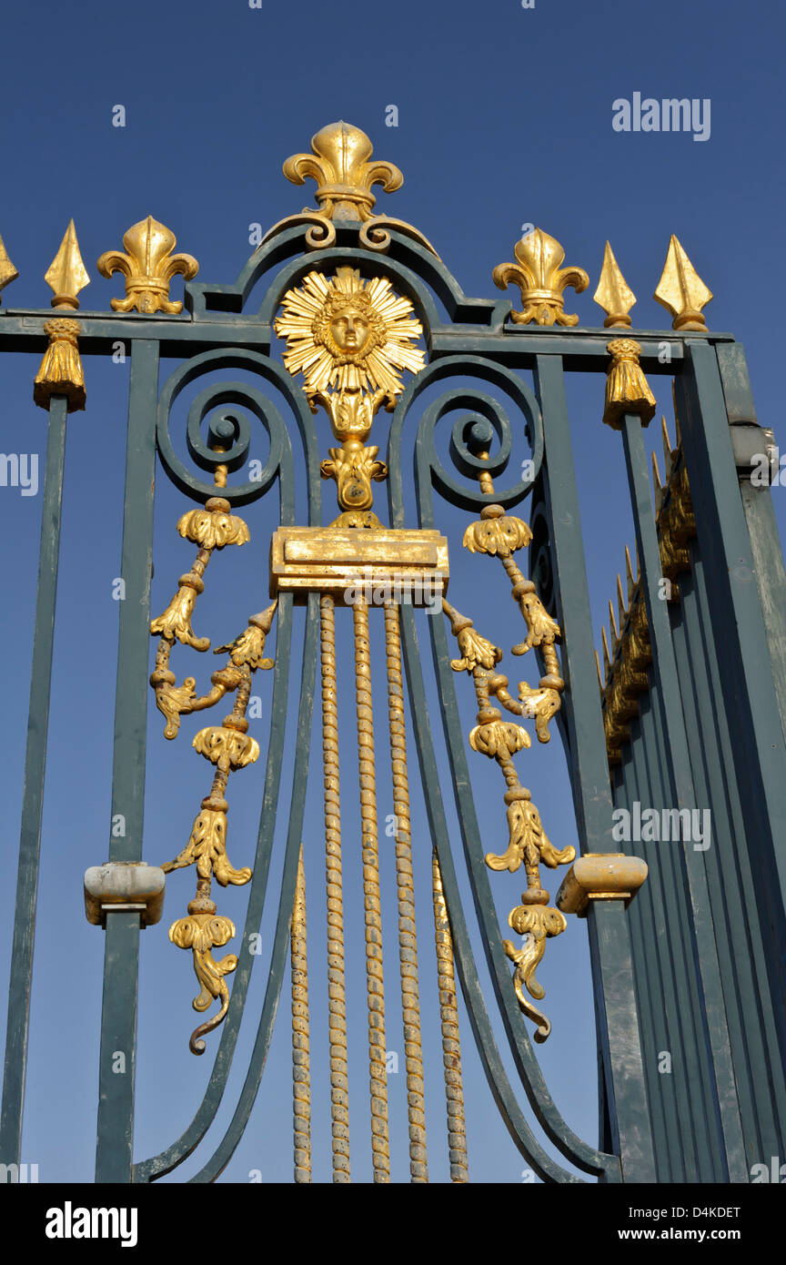 Gate ornate with golden design at Versailles Palace, France Stock Photo ...
