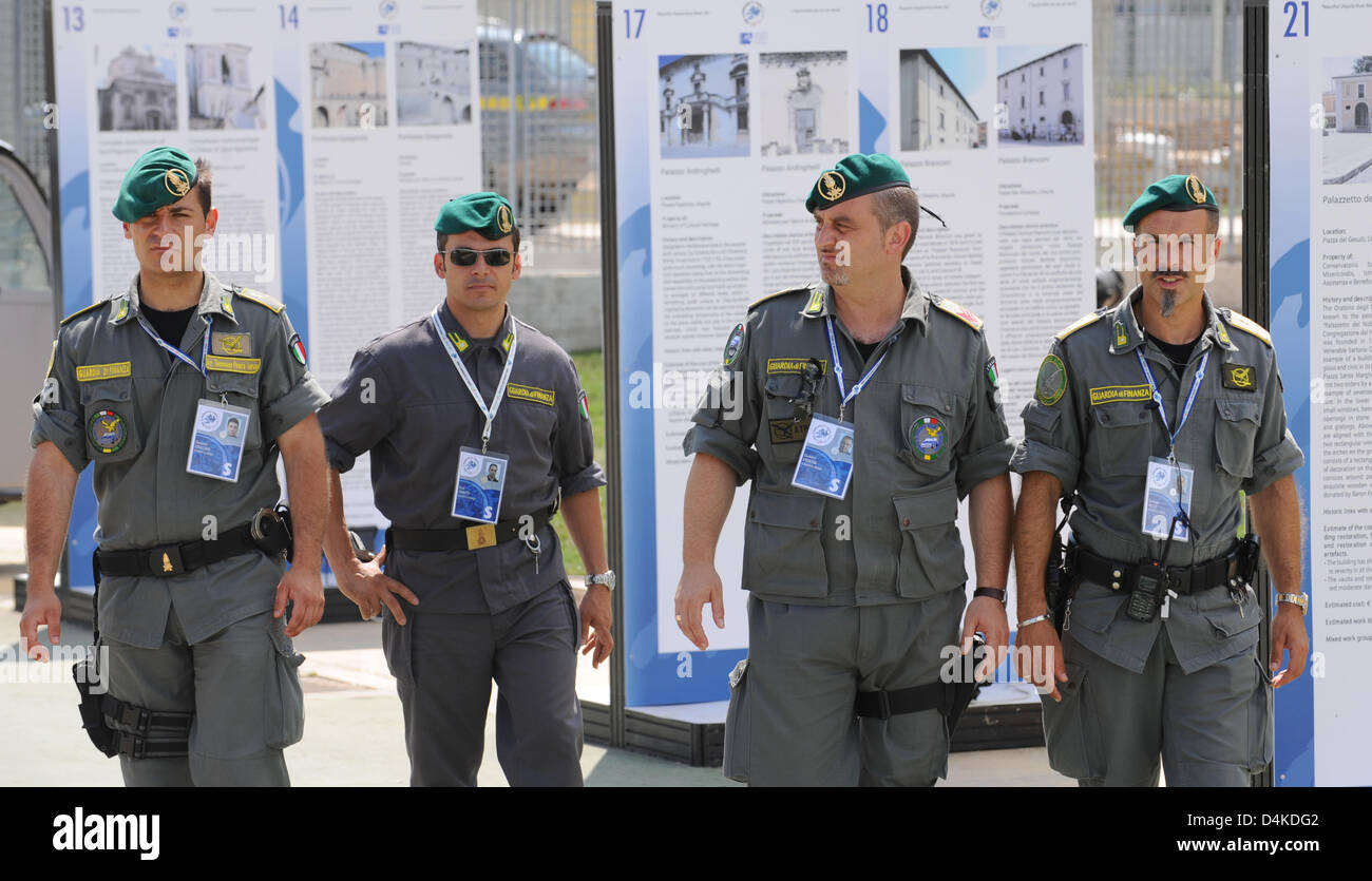 Security forces guard the press centre for the G8 summit 2009 in L ...