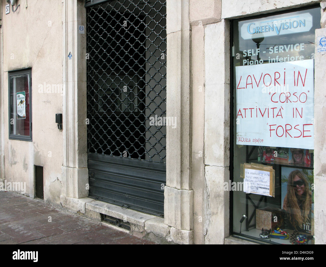 Badly damaged buildings and closed shops in L?Aquila, Abruzzi region ...