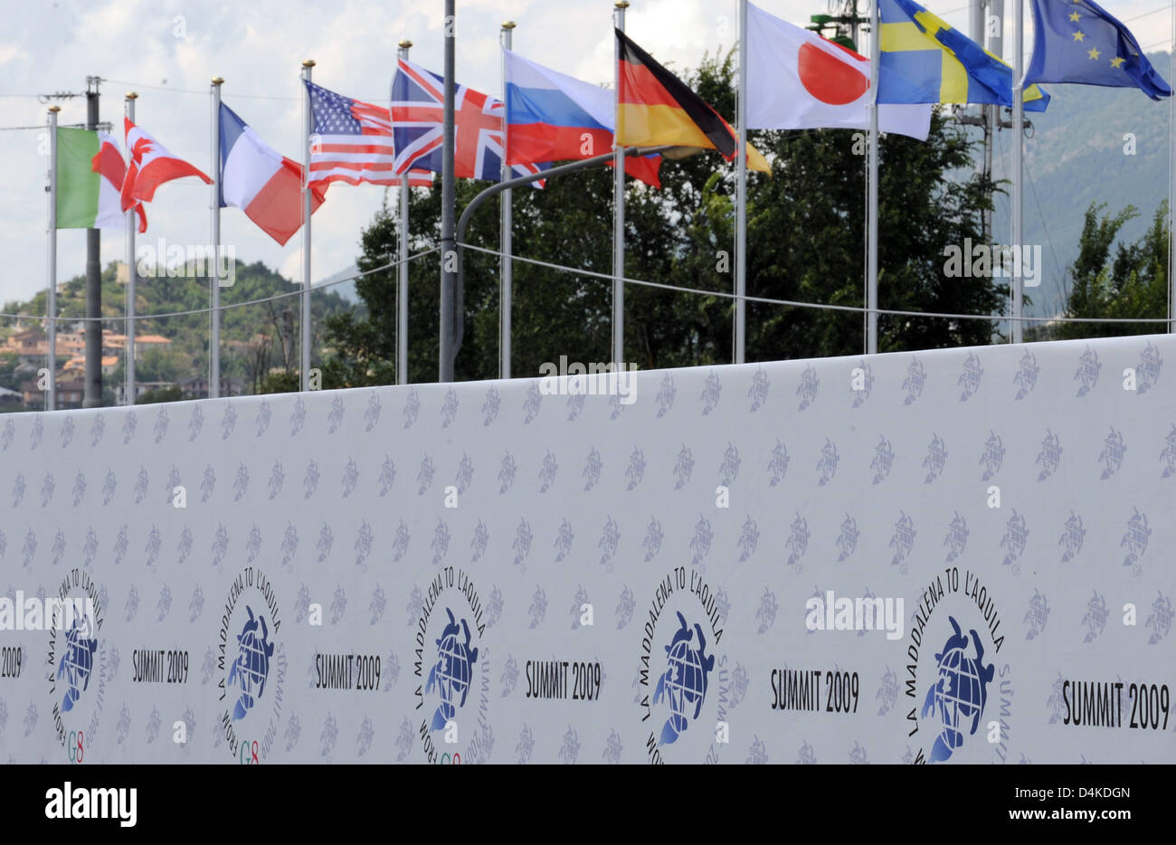 Flags of the participating nations wave in the wind outside the press ...