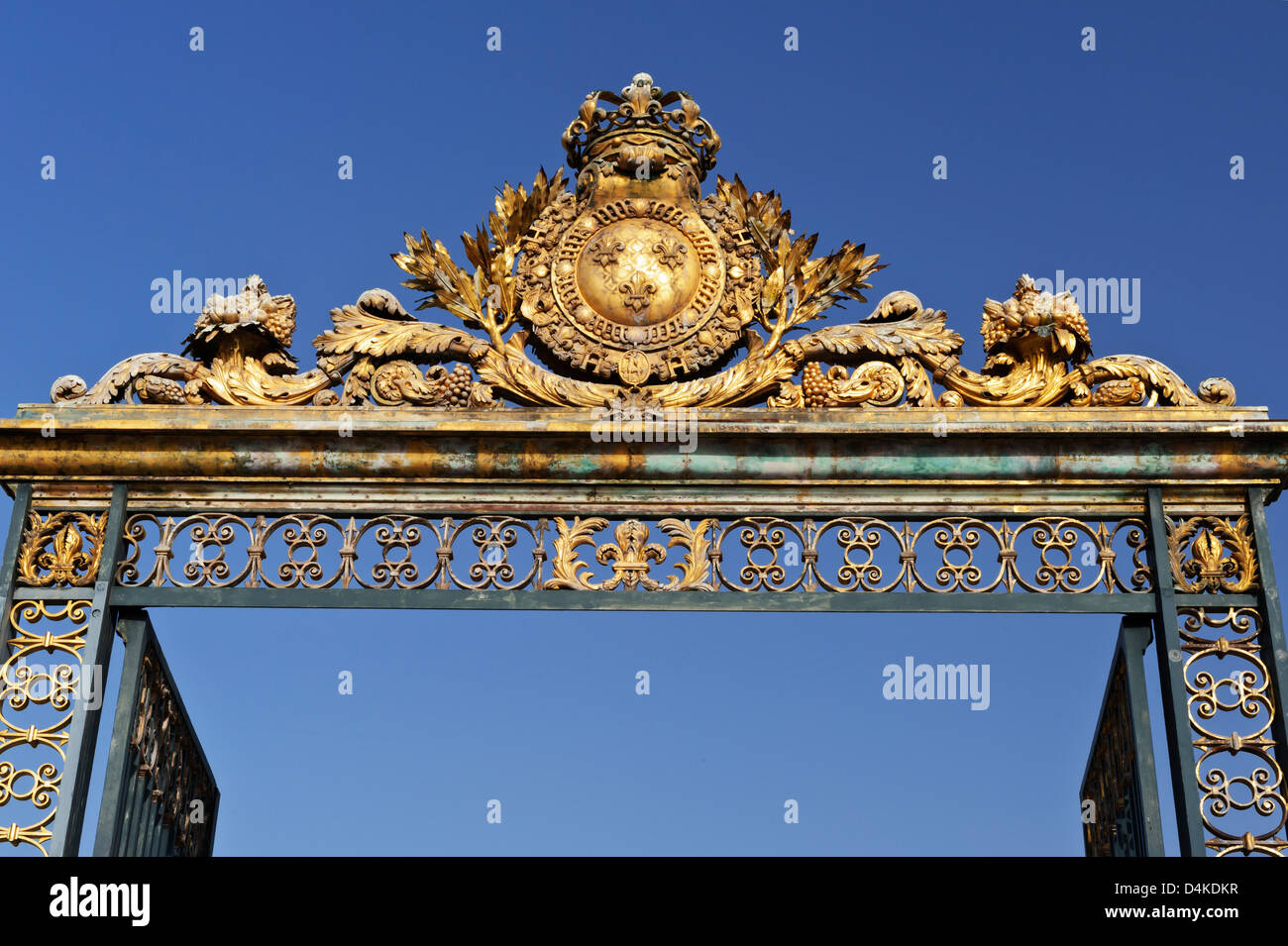 Gate ornate with golden design at Versailles Palace, France Stock Photo ...