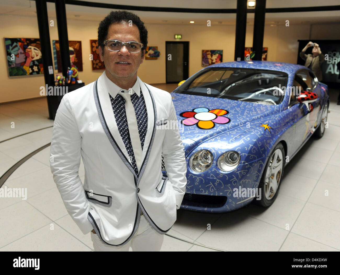 Brazilian artist Romero Britto stands in front of a Bentley Continental ...