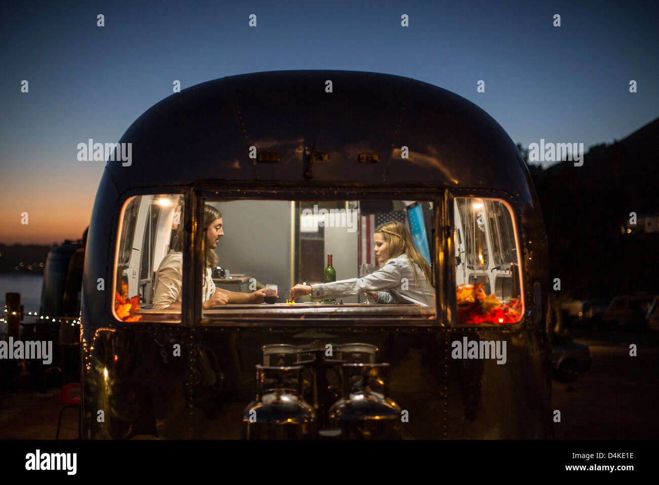 Couple eating together in trailer Stock Photo - Alamy