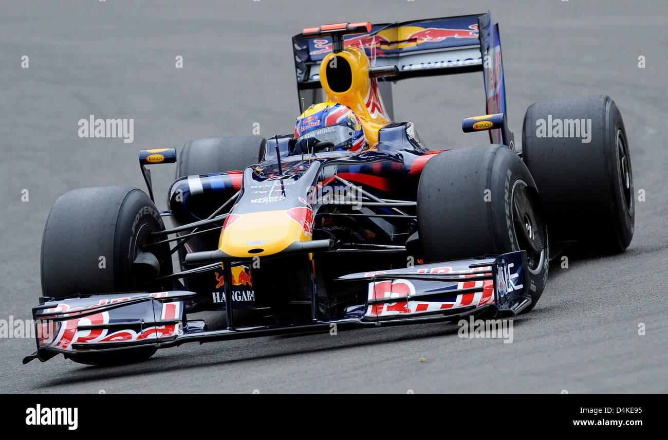 Australian Formula One driver Mark Webber of Red Bull Racing steers his ...