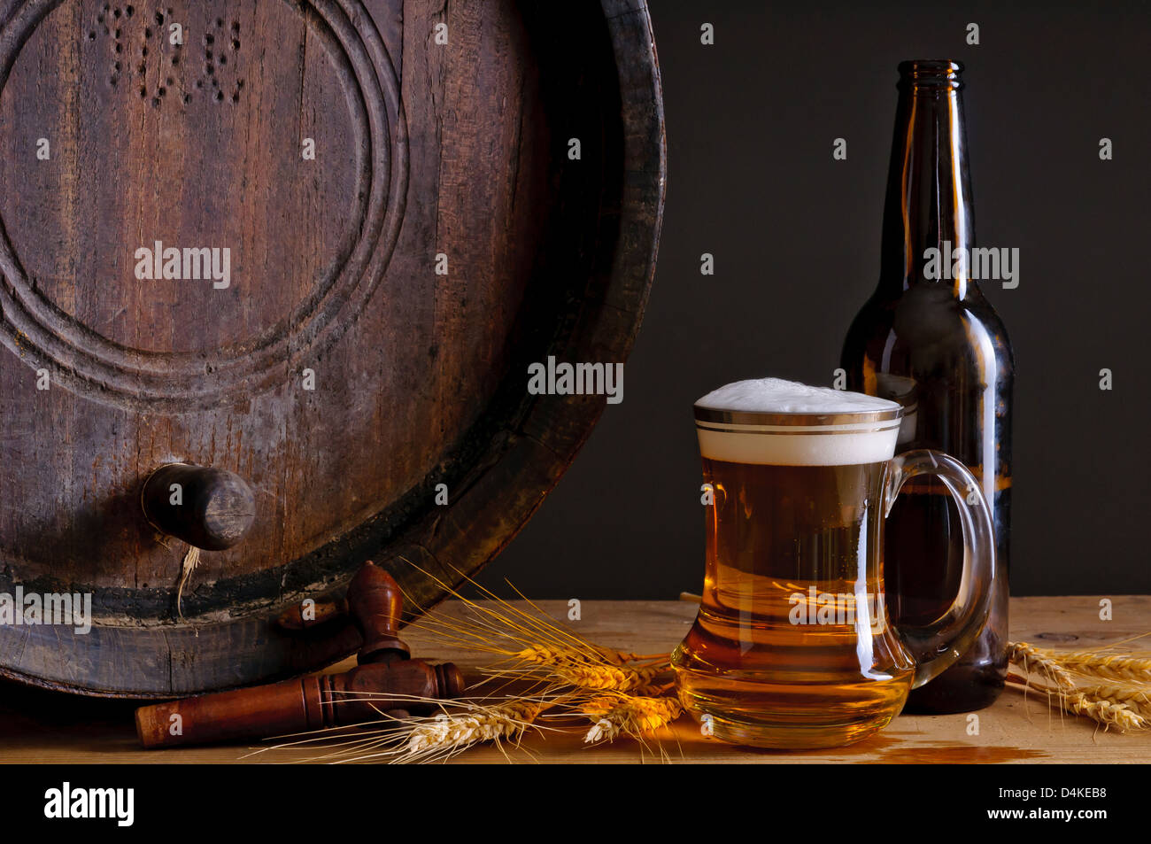 Still life composition with wooden barrel, glass and bottle of fresh ...