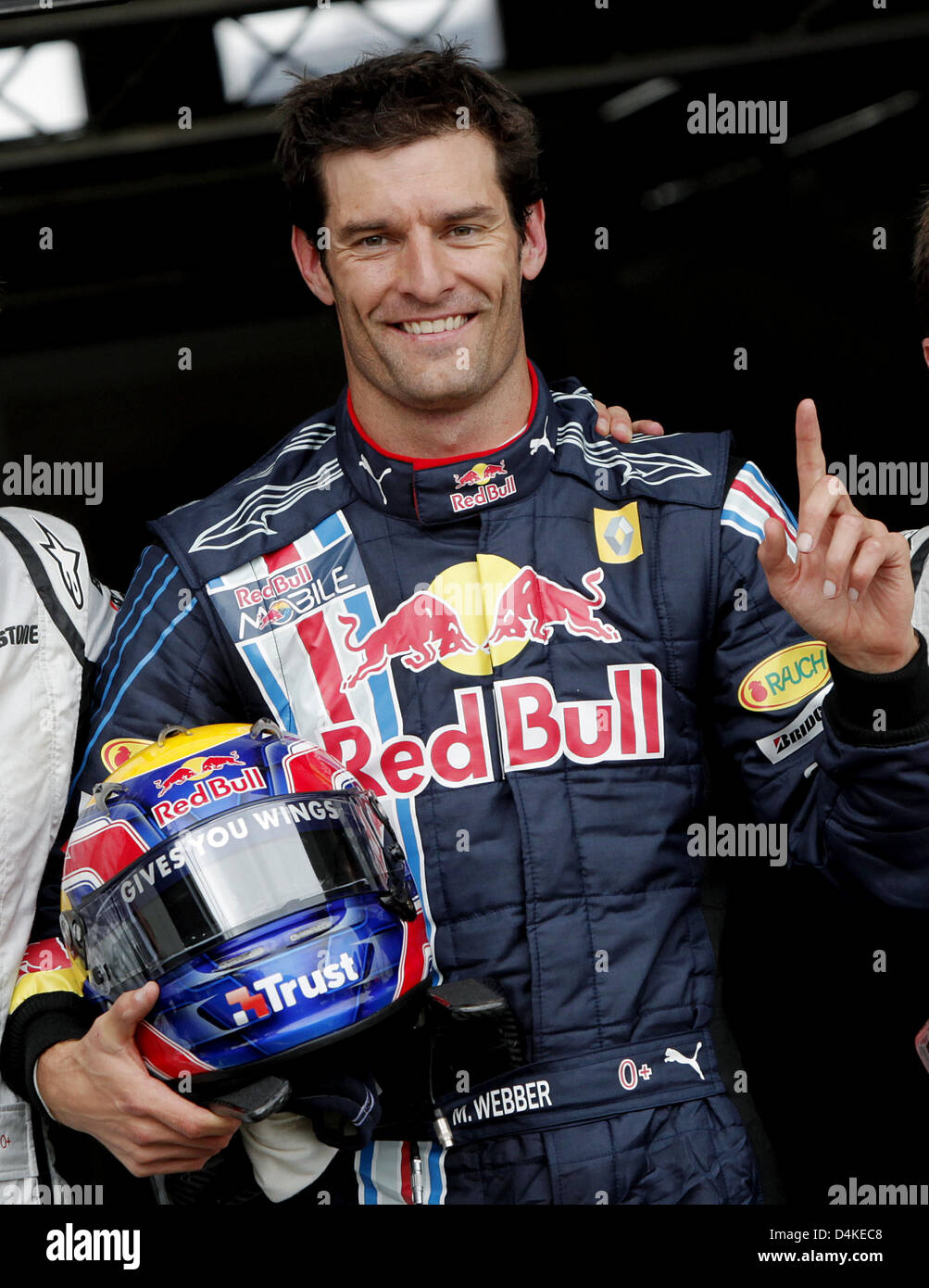 Australian Formula One driver Mark Webber of Red Bull Racing cheers ...