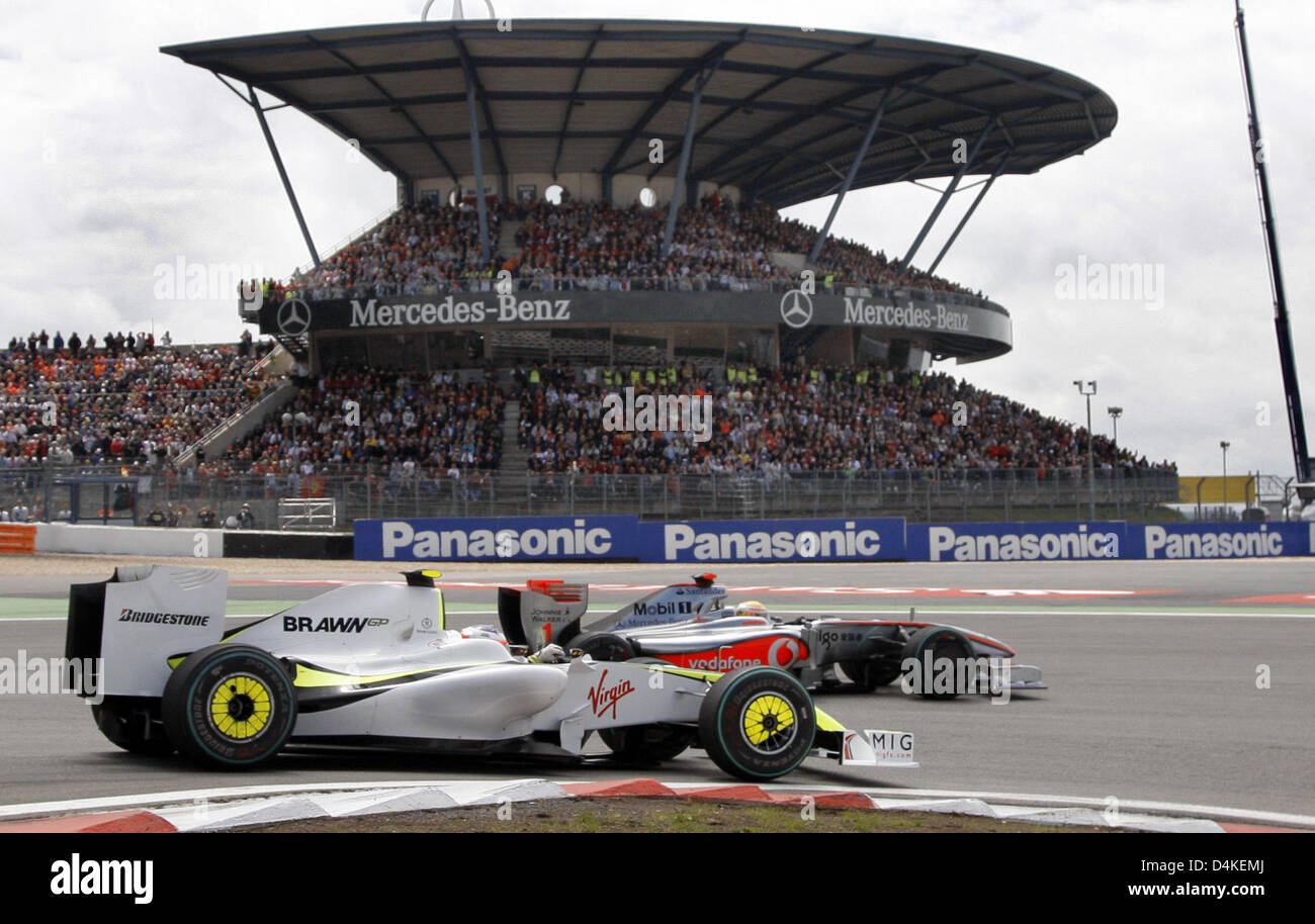 Brazilian Formula One driver Rubens Barrichello of Brawn GP (L) and ...