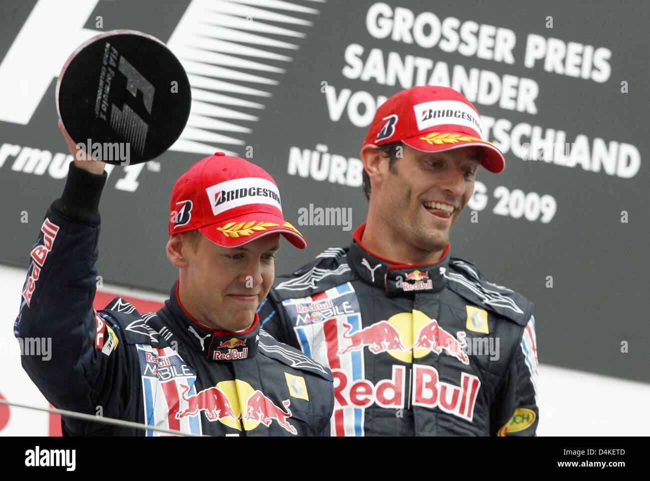 Australian Formula One driver Mark Webber (R) of Red Bull Racing and ...