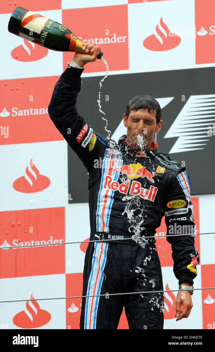 Australian Formula One driver Mark Webber of Red Bull Racing celebrates ...