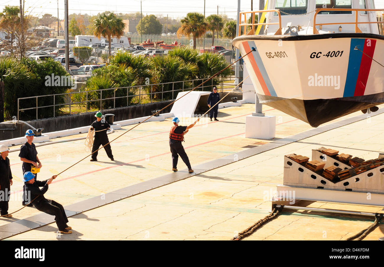The 41-foot utility boat is loaded aboard the Coast Guard Cutter Oak ...