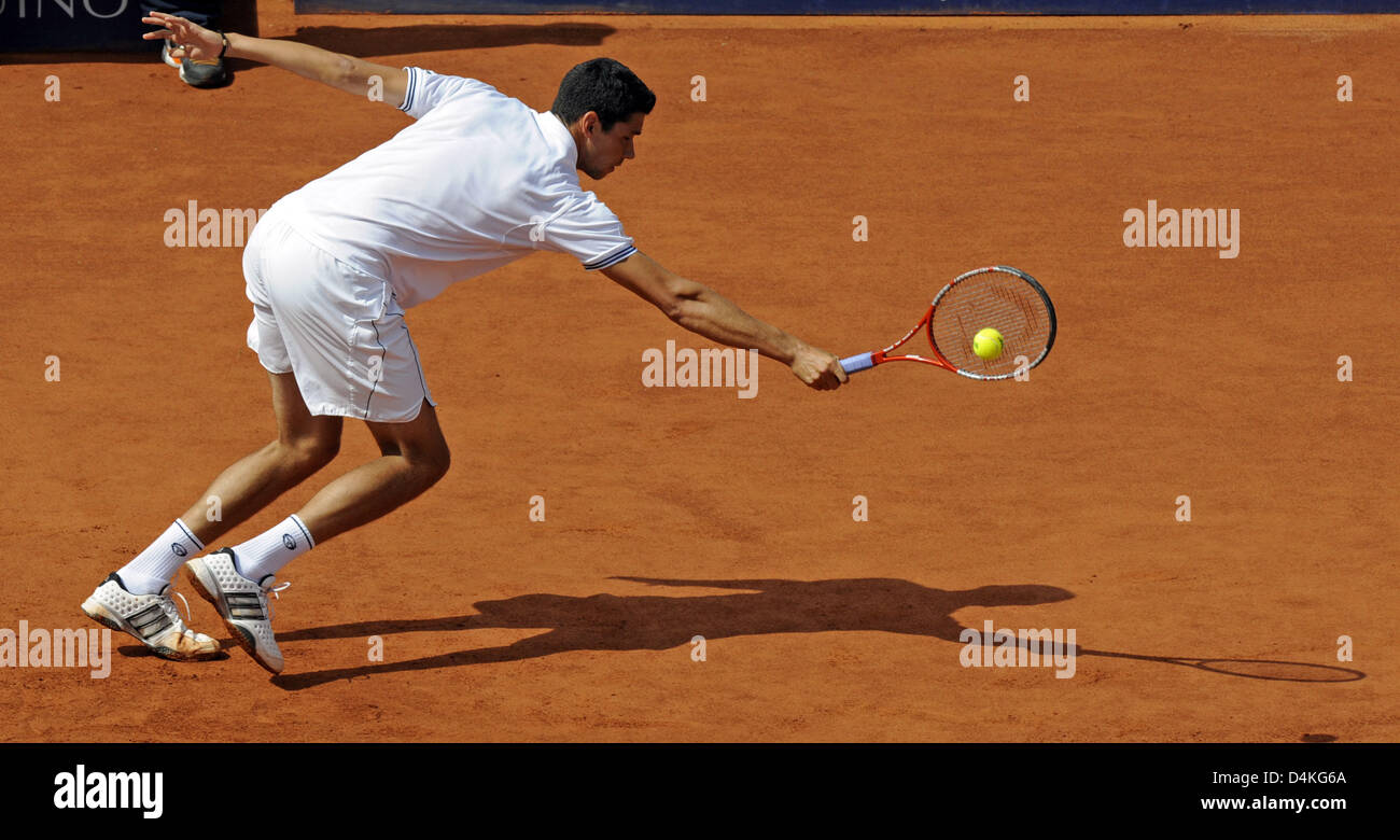 Romania?s Victor Hanescu returns a backhand to France?s Jeremy Chardy ...