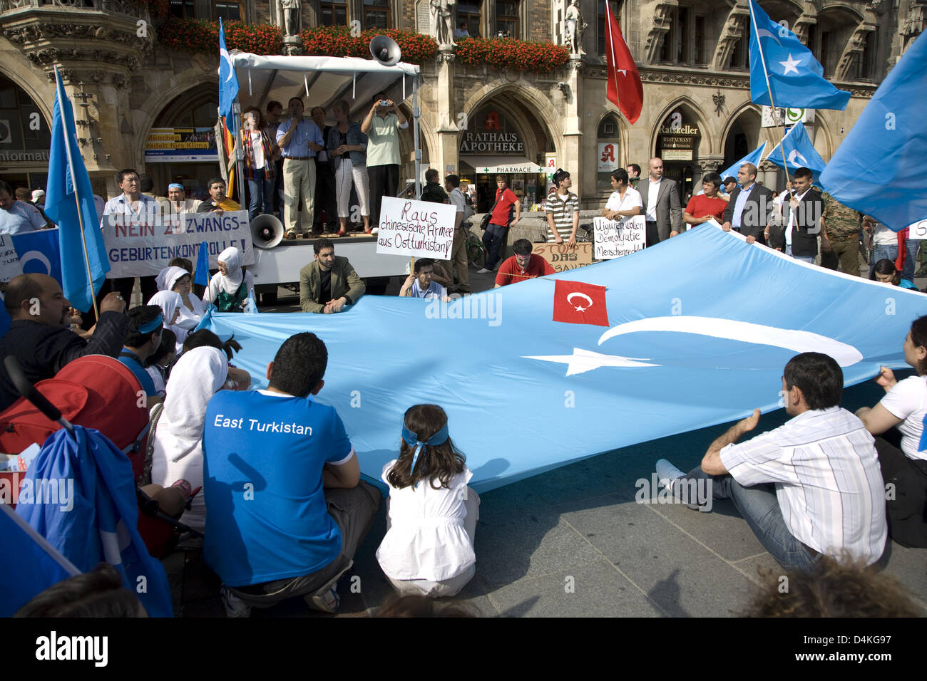 Members of the Uyghur ethnic group demonstrate against Chinese actions ...