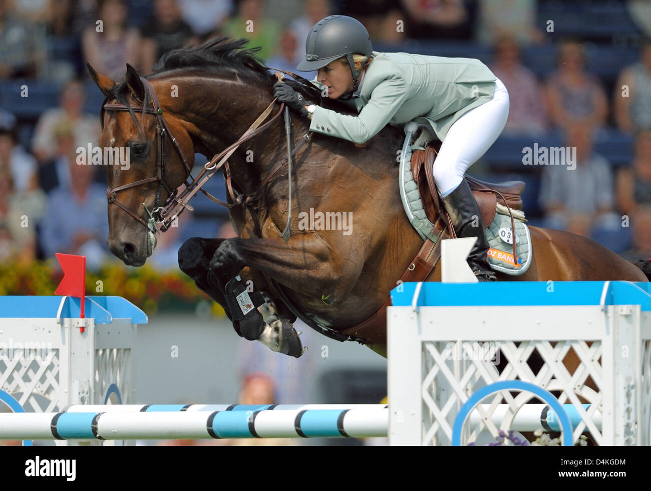 Meredith Michaels-Beerbaum from Germany clears an obstacle on her horse ...