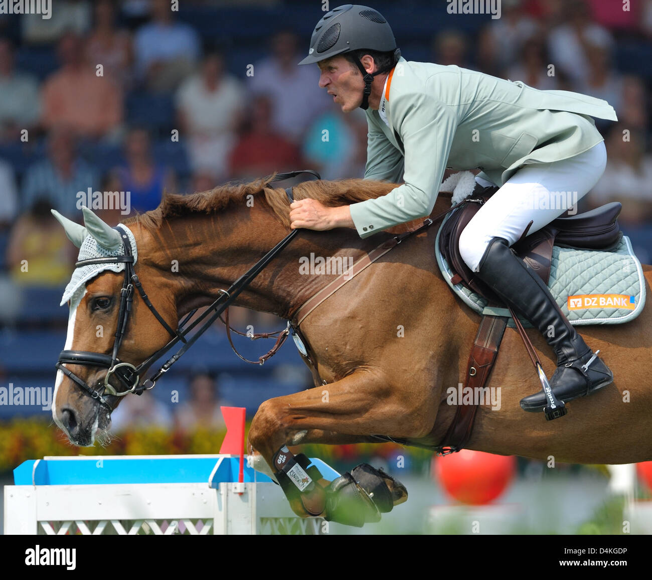 Ludger Beerbaum from Germany and his horse Gotha clear an obstacle ...