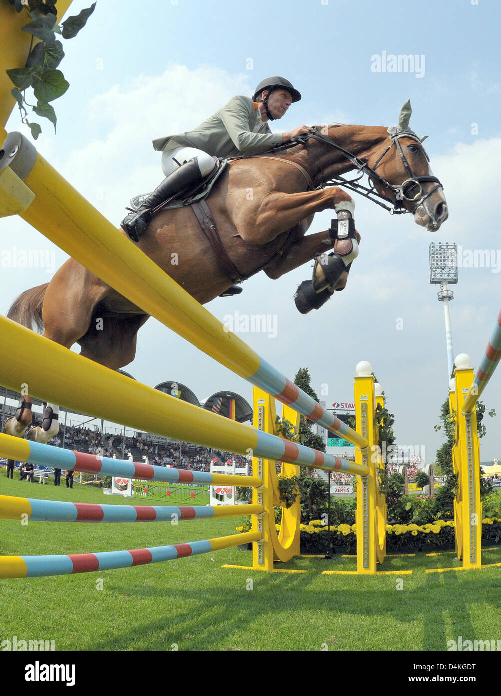 Ludger Beerbaum from Germany and his horse Gotha clear an obstacle ...