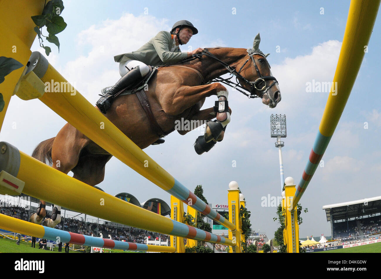Ludger Beerbaum from Germany and his horse Gotha clear an obstacle ...