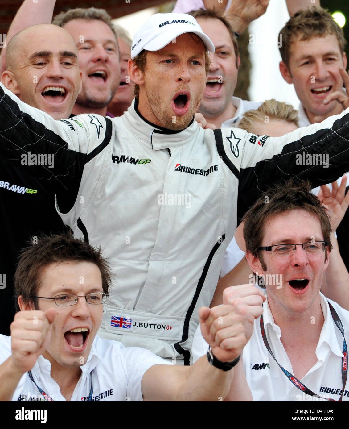 Brawn gp driver jenson button celebrates hi-res stock photography and ...