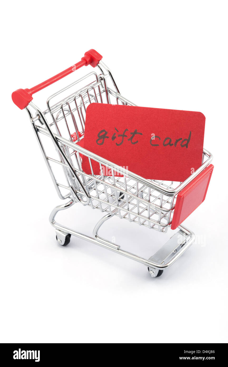 Gift card words written on red paper card in shopping cart on white ...