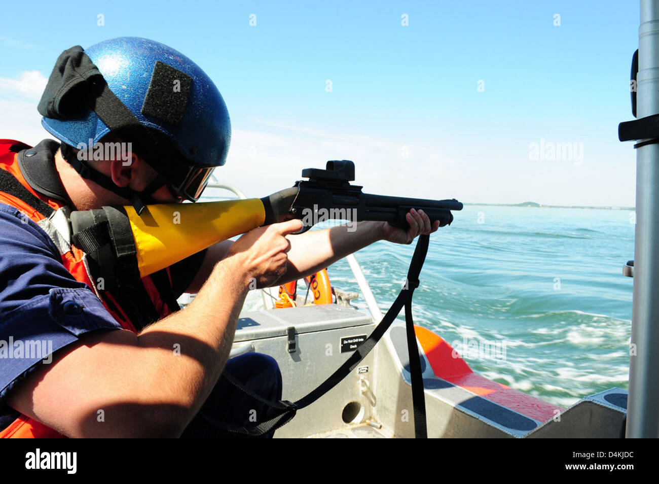 Petty Officer 3rd Class Owens takes aim during training with less-than ...