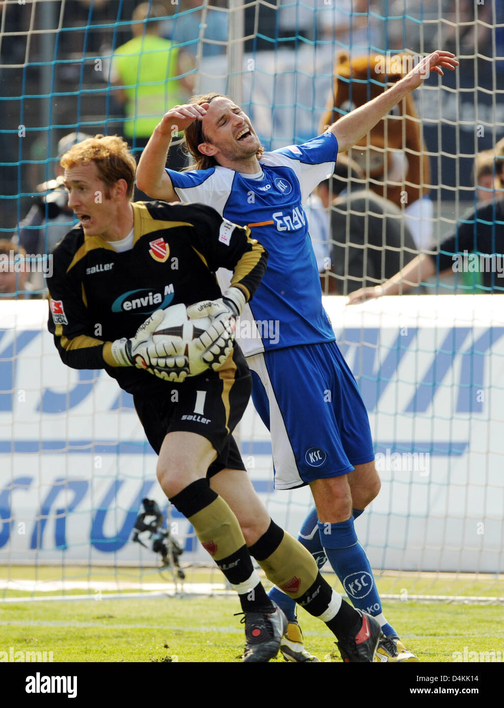 Karlsruhe?s striker Joshua Kennedy (R) gestures in disbelief after ...