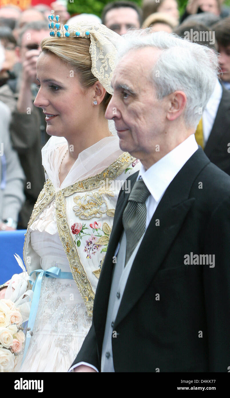 The bride, Philomena de Tornos, is escorted to the church by her father ...