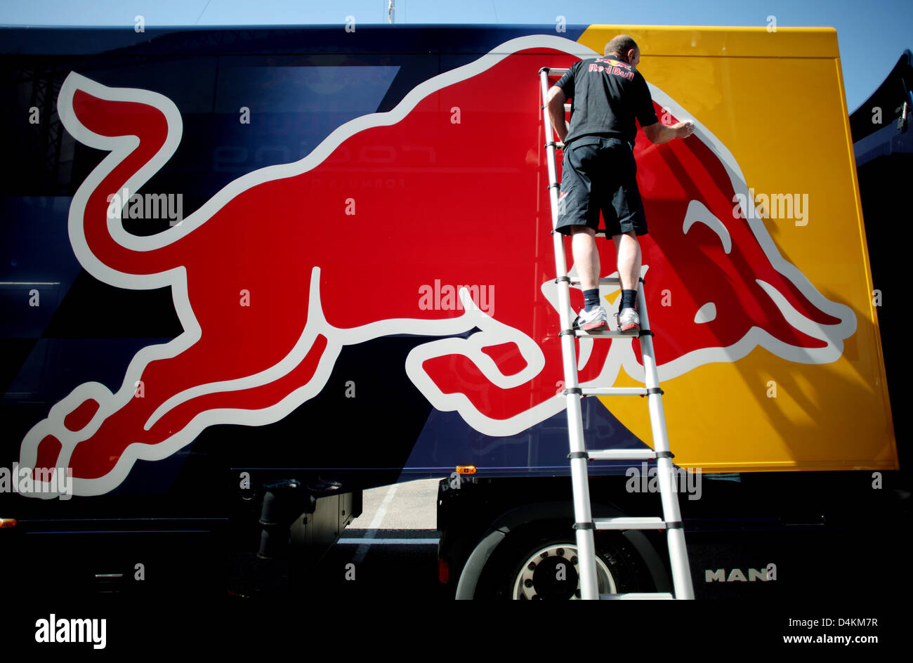 A mechnic of Red Bull Racing cleans a team truck at the Circuit de ...