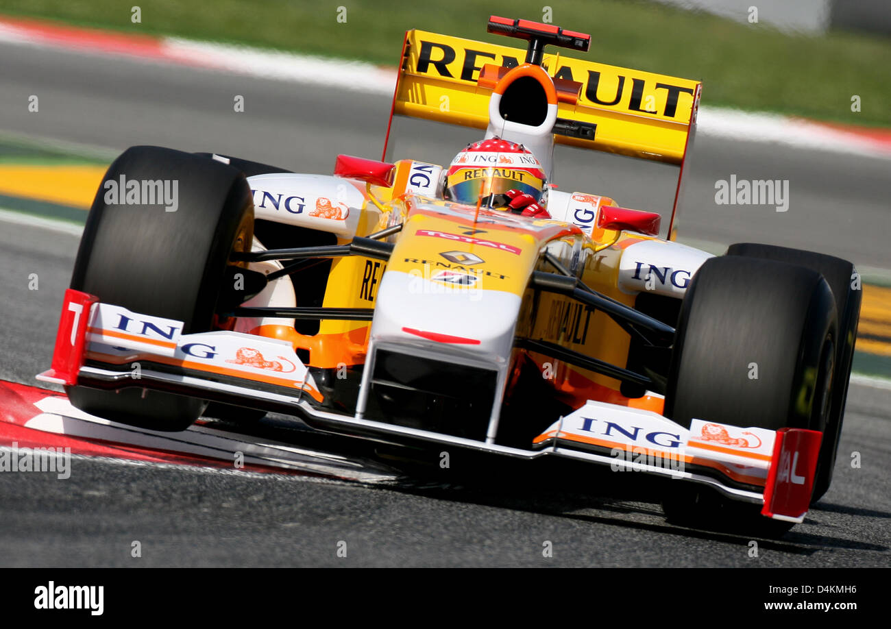 Spanish Formula One driver Fernando Alonso of Renault F1 Team greets ...