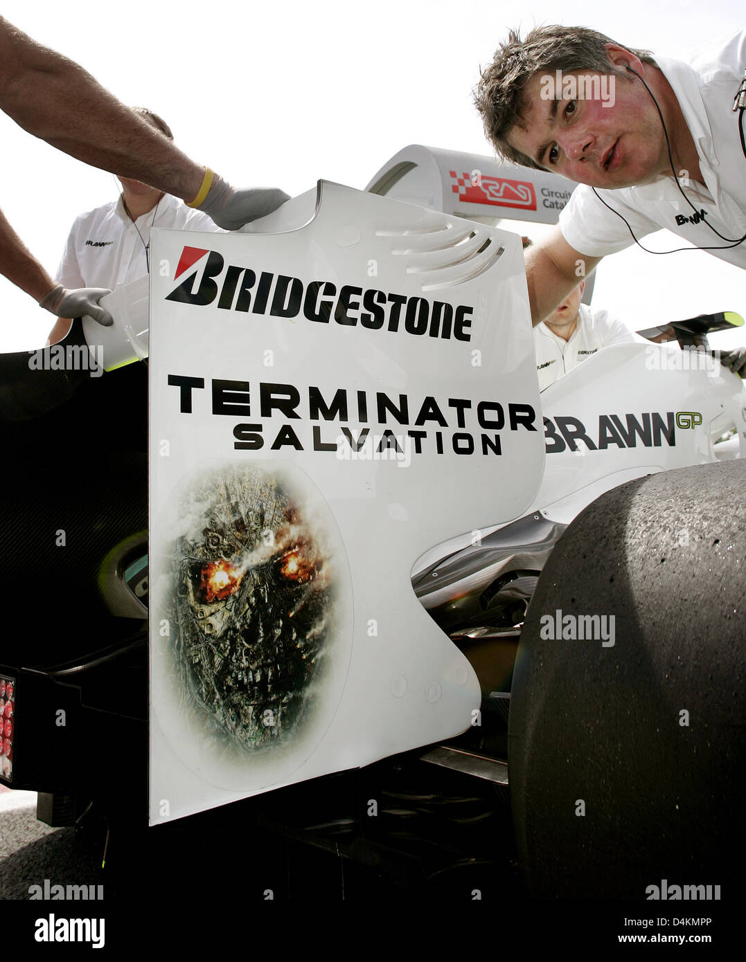 Mechanics of Brawn GP push Brazilian Formula One driver Rubens ...