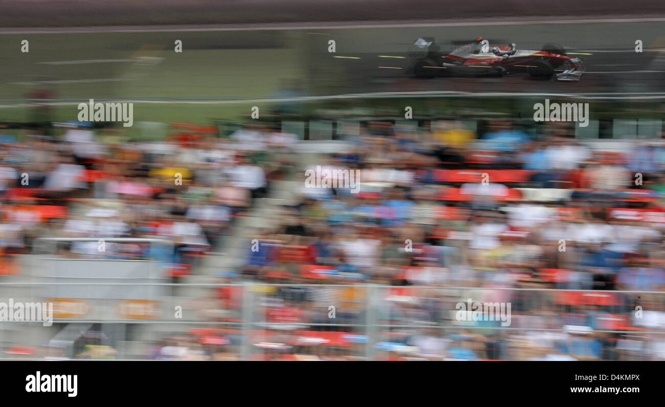 Italian Formula One driver Jarno Trulli of Toyota mirrors during the ...