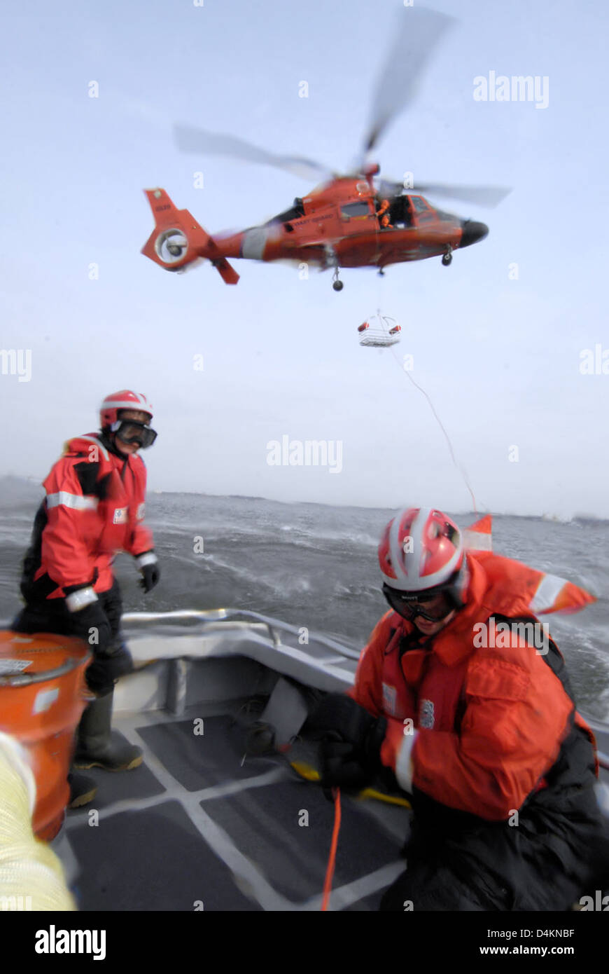A U.S. Coast Guard unit performs helicopter training exercises over the ...