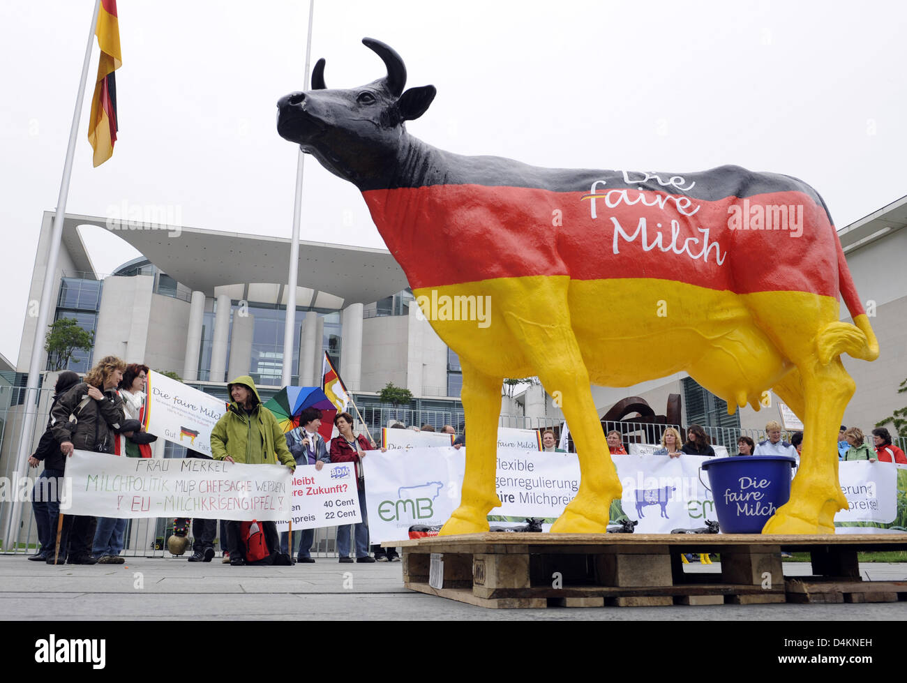 Female dairy farmers stage a protest against low milk prices using a ...