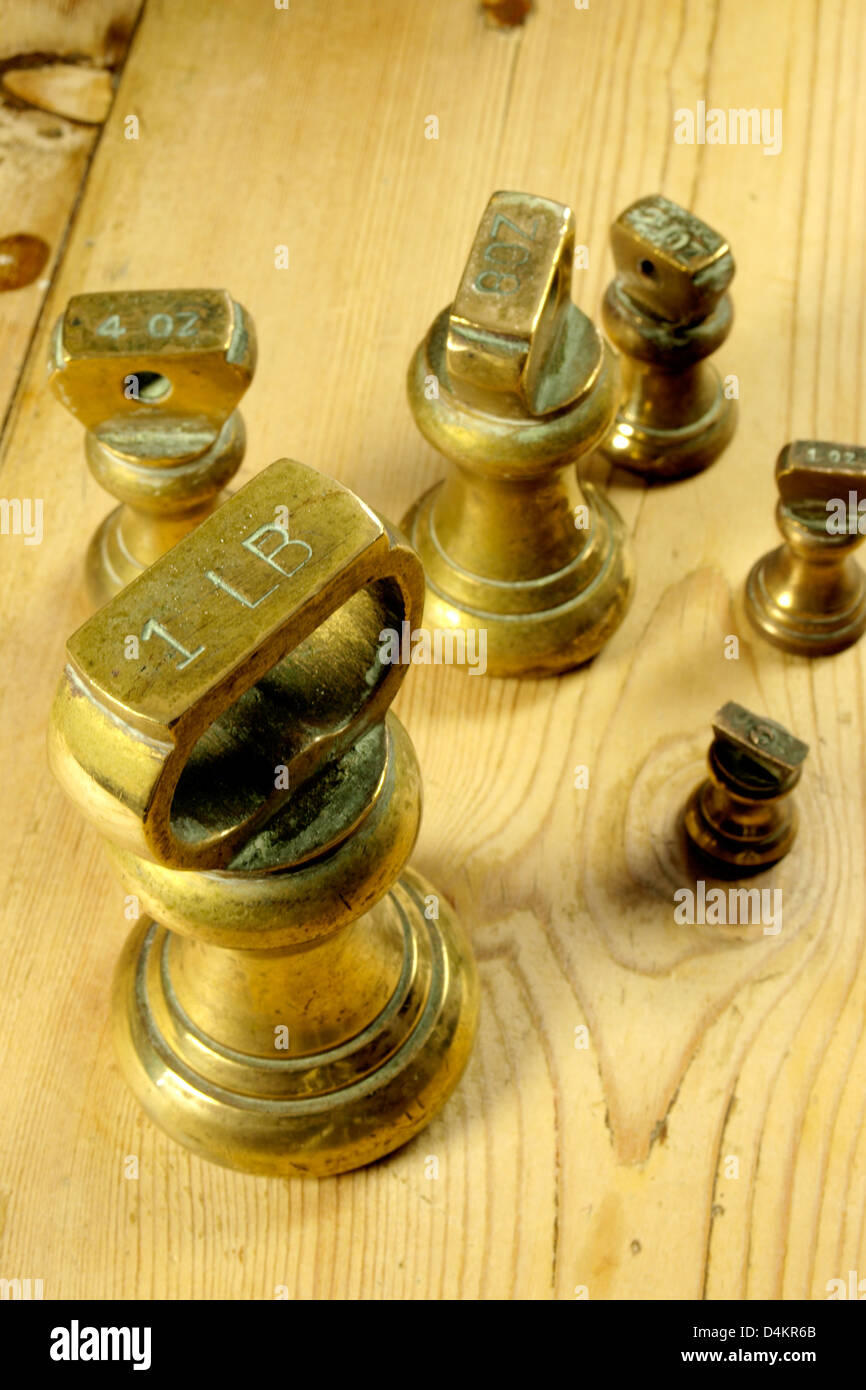 Brass pound weights Stock Photo - Alamy