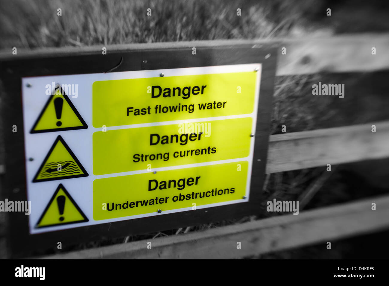 Warning sign near weir Stock Photo - Alamy
