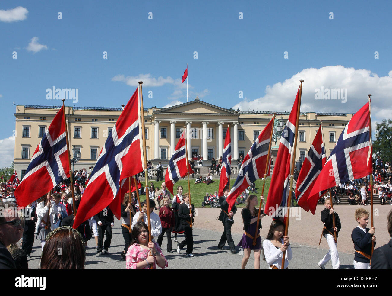 People parade in front of the Royal Palace during the celebrations of ...