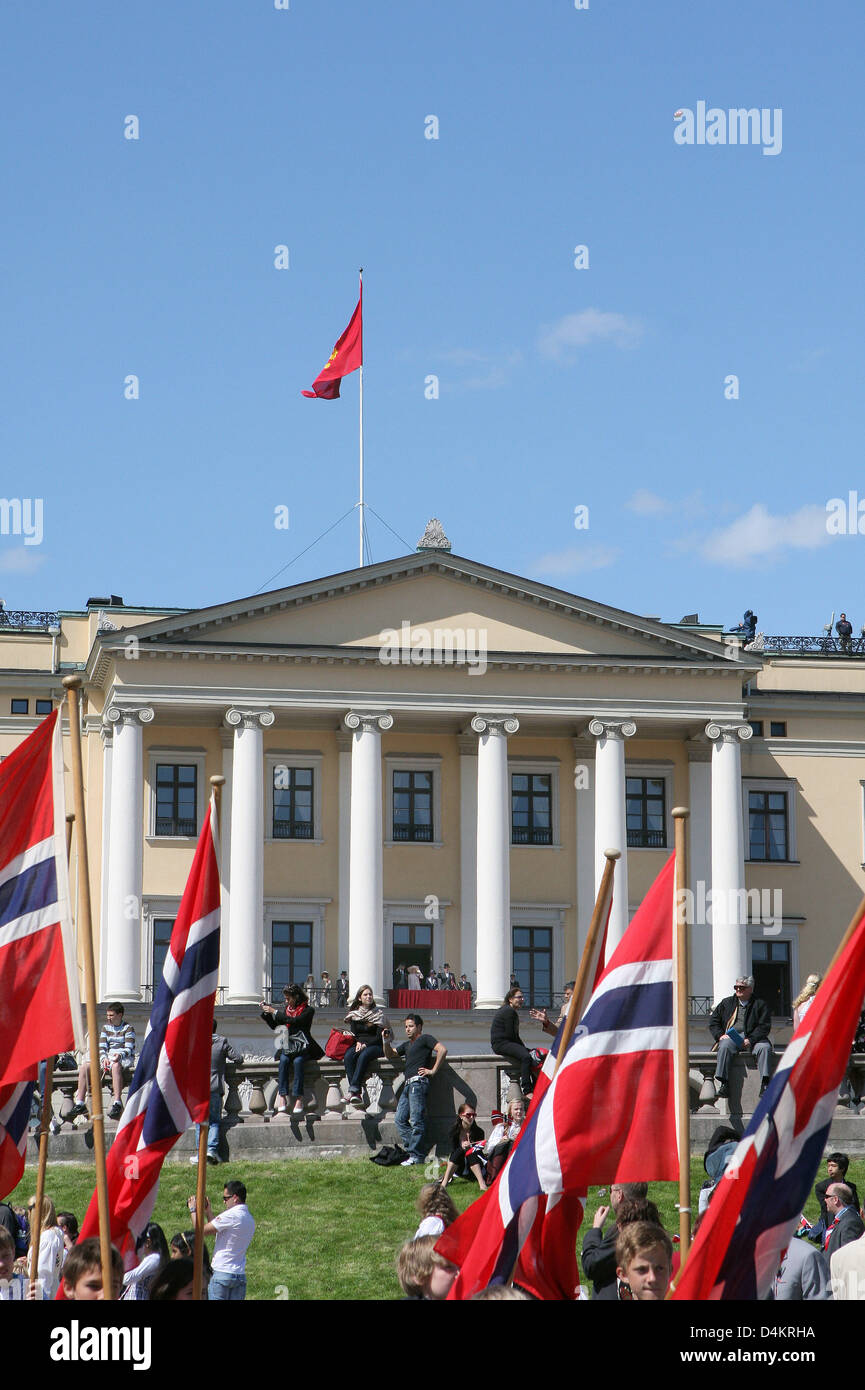 People parade in front of the Royal Palace during the celebrations of ...