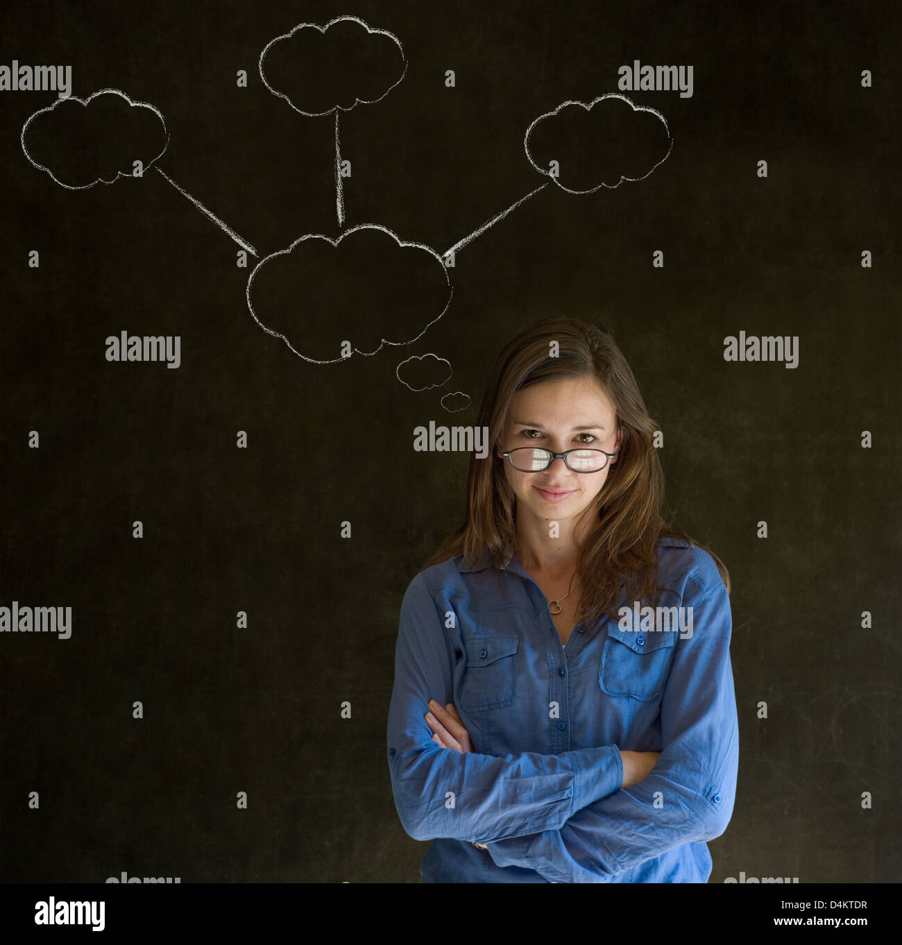 Thinking business woman with chalk cloud thoughts on blackboard ...