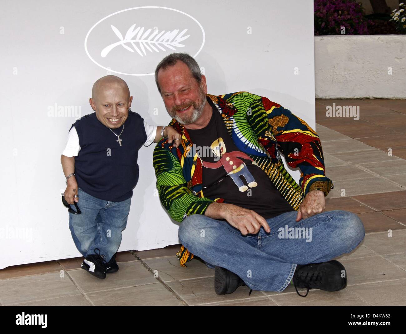 UK director Terry Gilliam (R) and US actor Verne Troyer pose before the ...