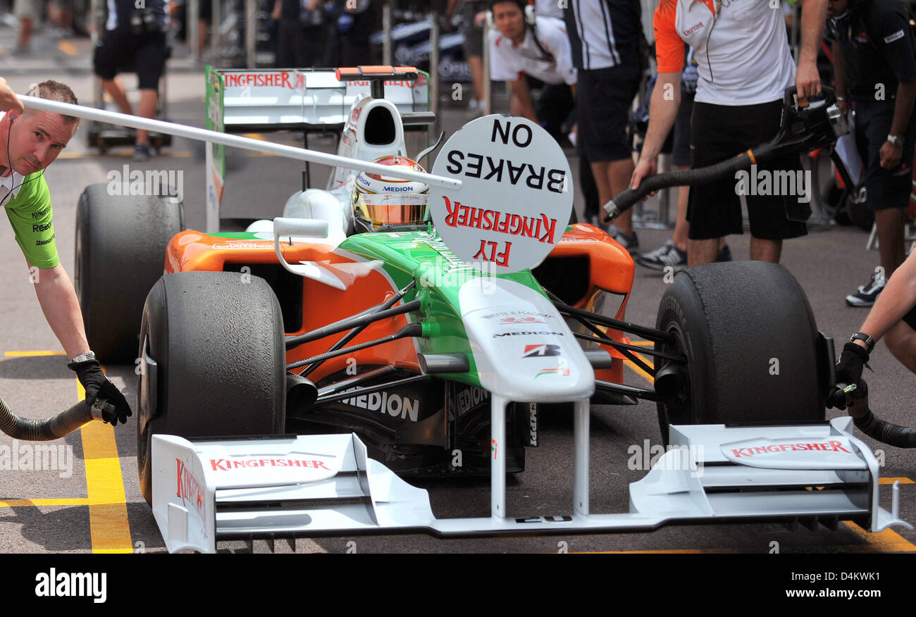 German Formula One driver Adrian Sutil of Force India trains a pit stop ...